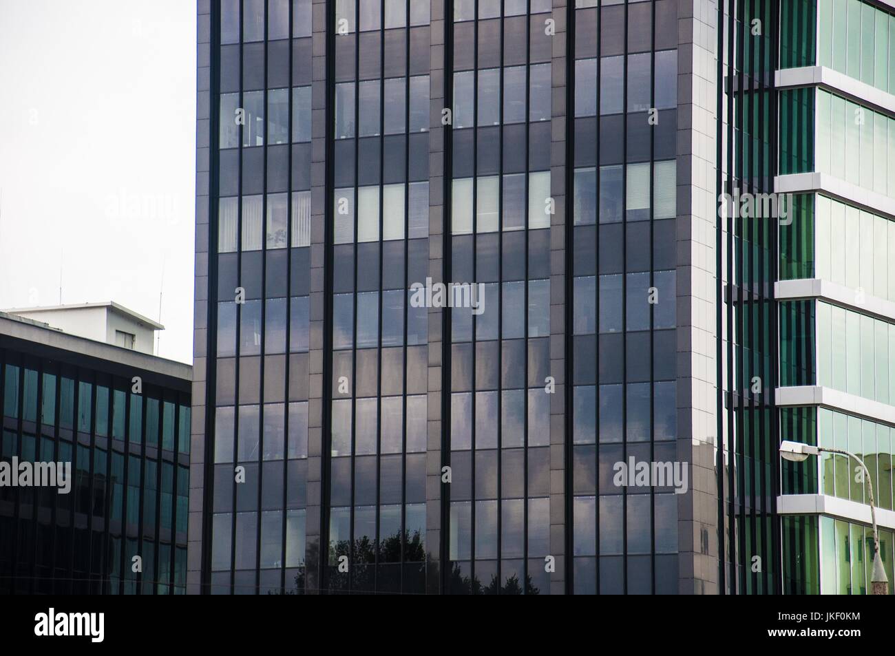 a modern glass commercial building in city downtown Stock Photo - Alamy