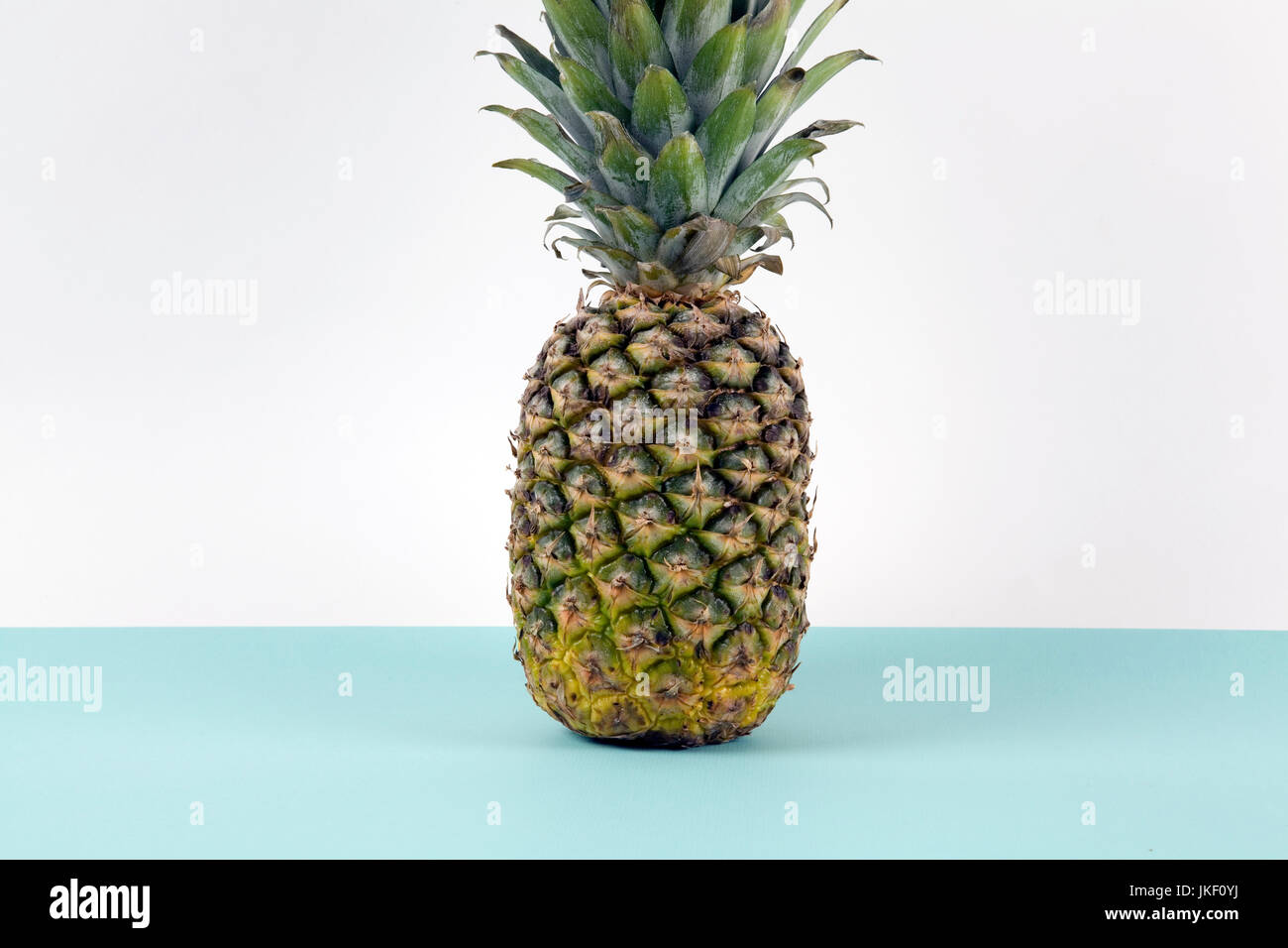 Playful pineapple on a pop bicolor background turquoise and white like ...