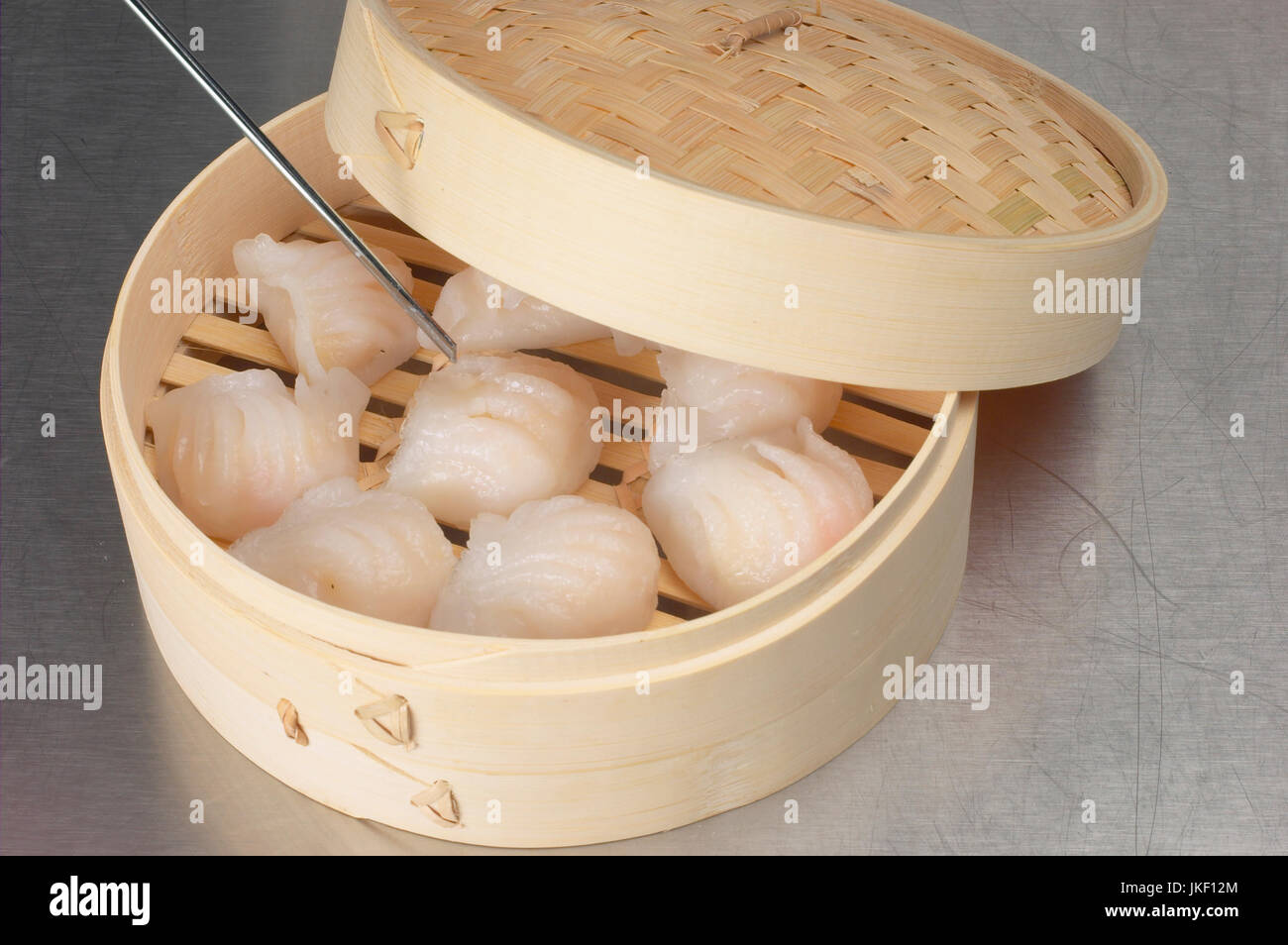 Dumplings in a wooden container Stock Photo - Alamy