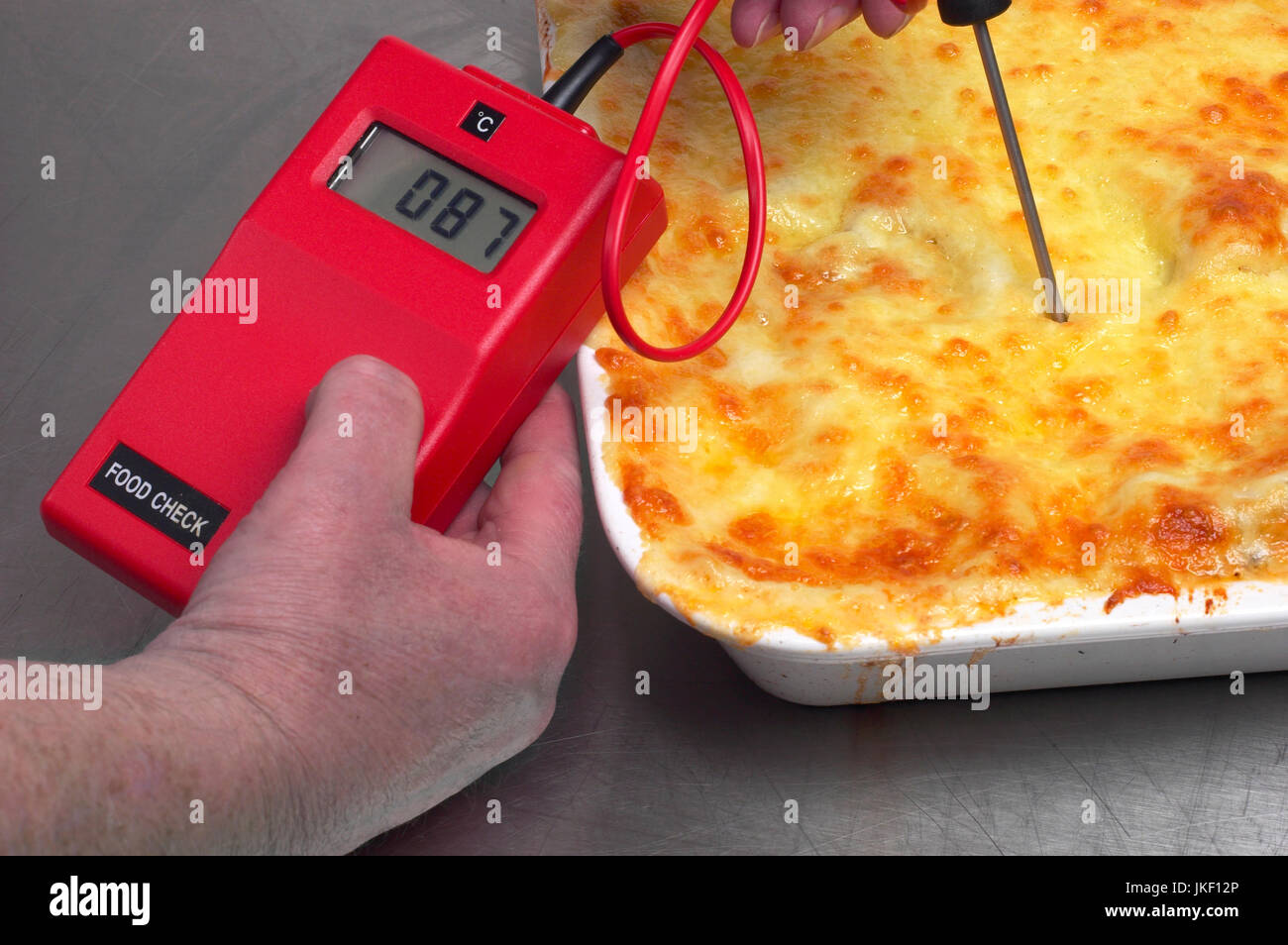 Testing the temperature of cooking food Stock Photo - Alamy