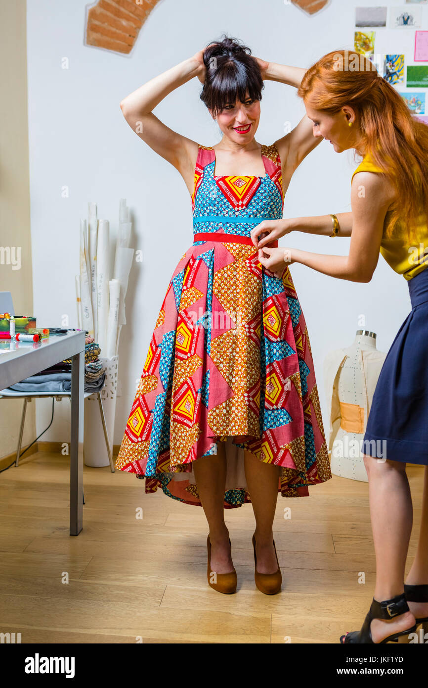 Fashion designer seamstress trying on hi-res stock photography and ...
