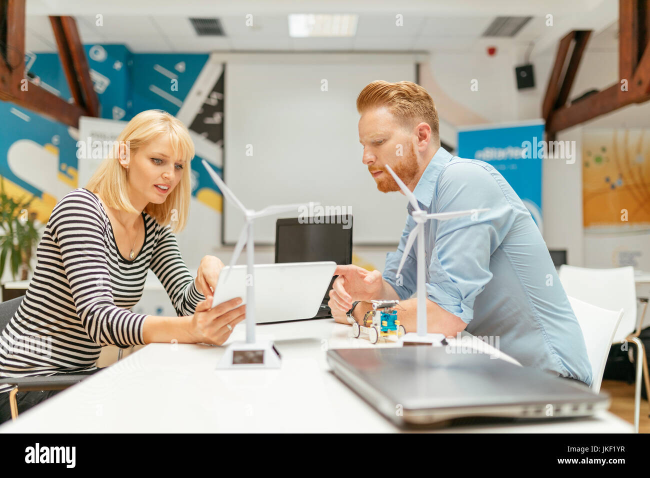 Business people discussing project in office Stock Photo - Alamy