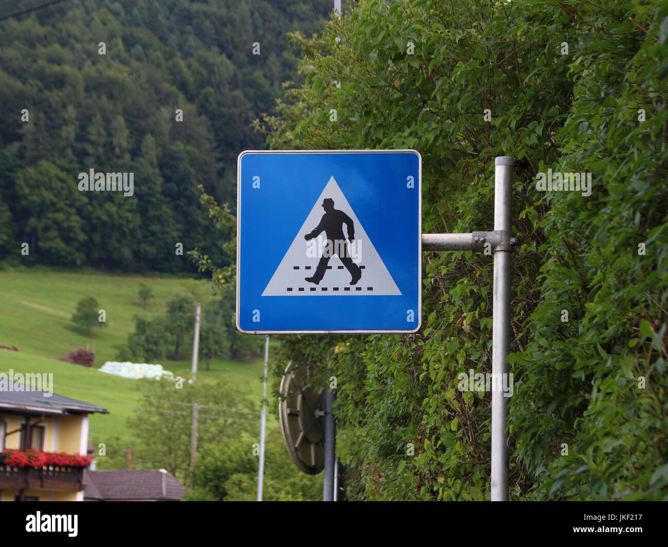 Warning Pedestrian Sign of Man with Hat at Crossover Stock Photo - Alamy