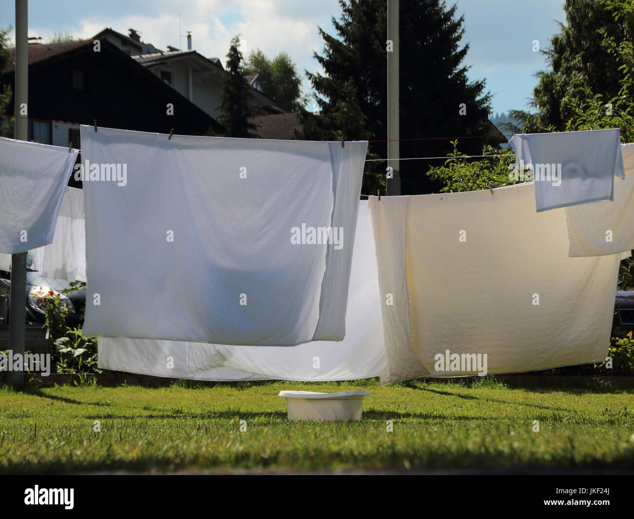 White Laundry Linen Drying in the Sun with Backlight Stock Photo - Alamy