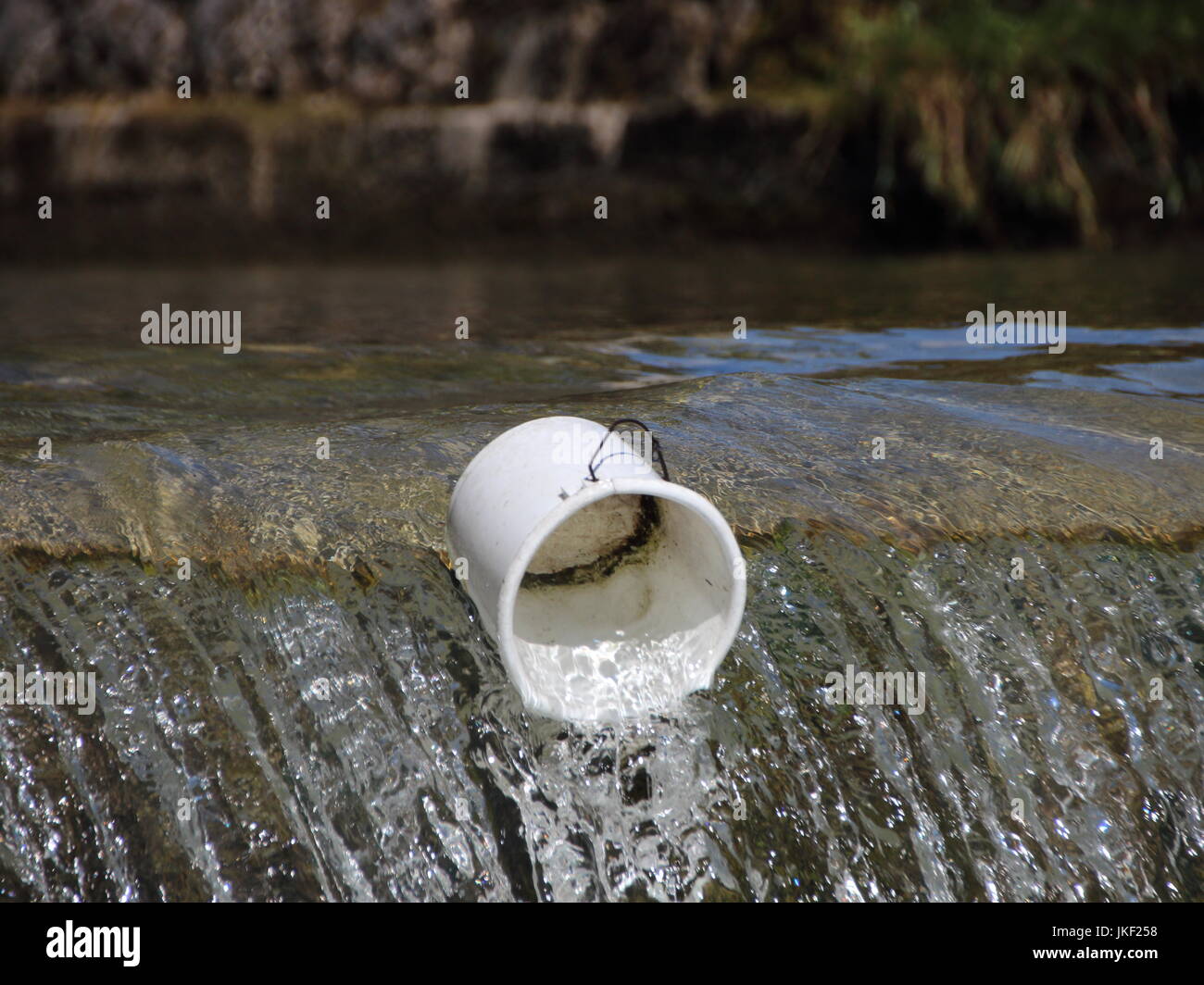 Bucket on Waterfall in Drain Canal with Melting Water from Mountains ...