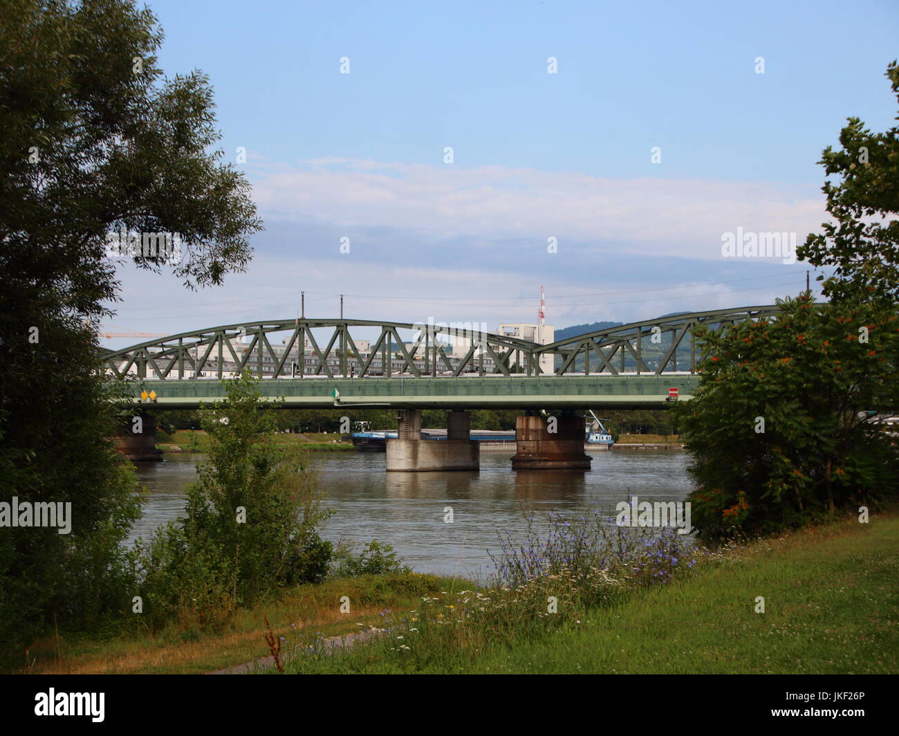 Green Steel Railway Steel Bridge viewed from Park near Donau River ...