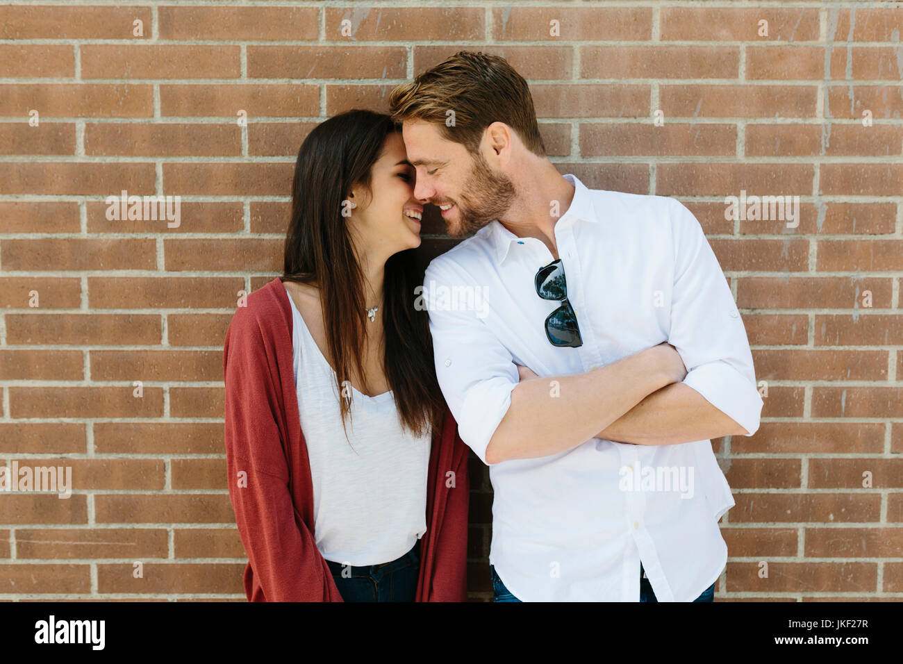 Affectionate couple love kissing front wall outdoors hi-res stock ...