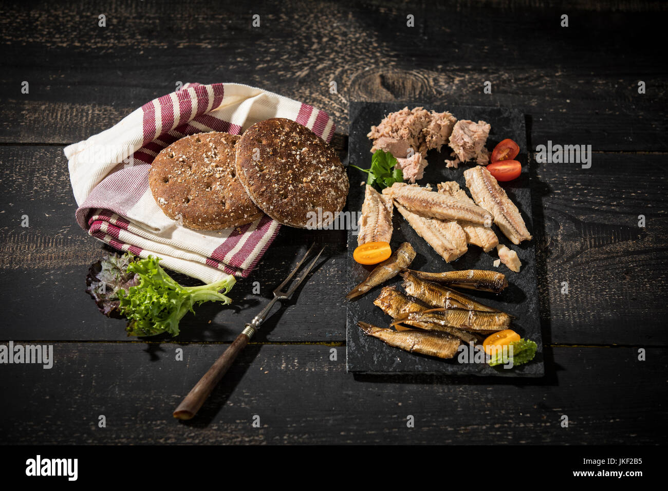 Cold fish platter with tuna, sprats and sardines Stock Photo - Alamy