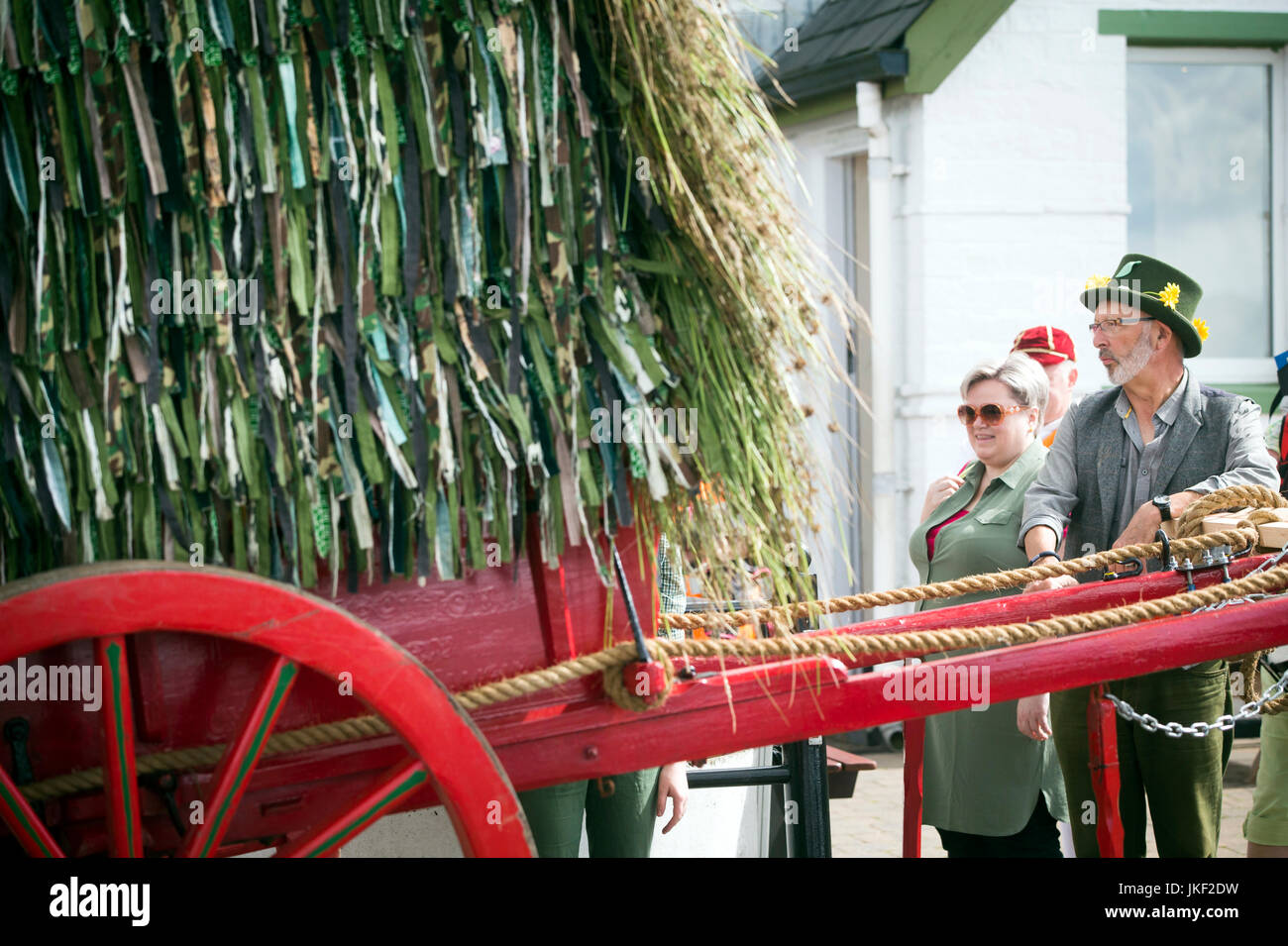 People take part in the Rush Cart procession during the Rushbearing ...