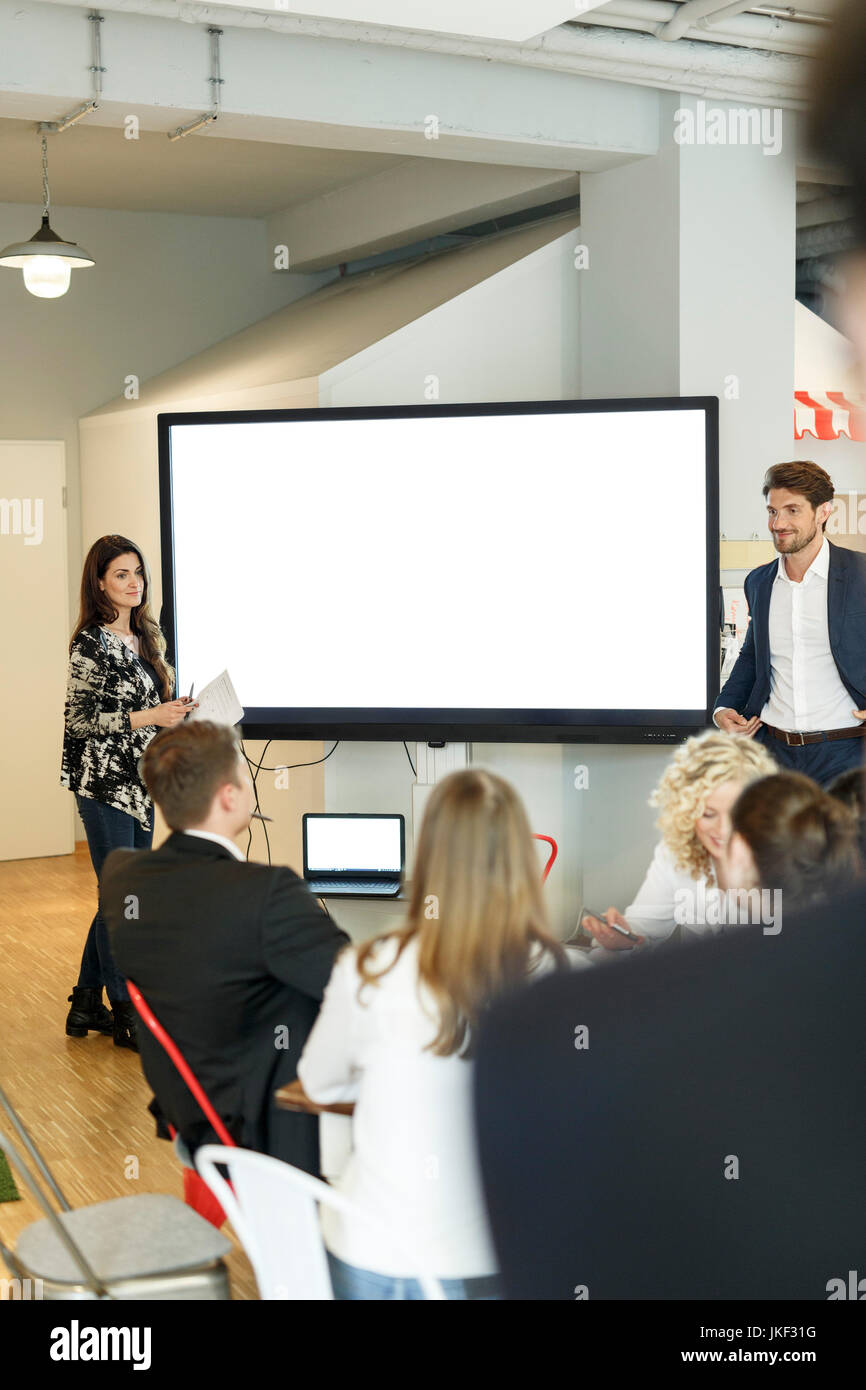 Presentation in office at large screen Stock Photo - Alamy