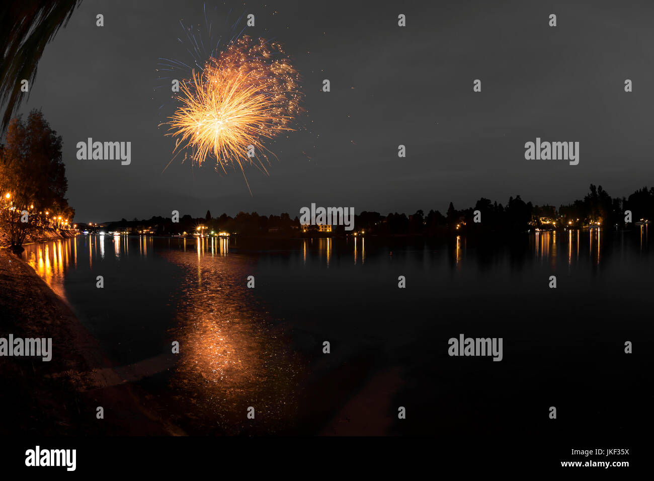 Fireworks on the river Ticino in a summer evening with landscape in the ...