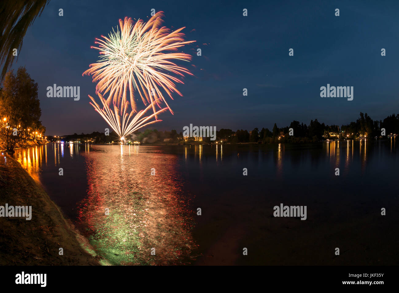 Fireworks on the river Ticino in a summer evening with landscape in the ...
