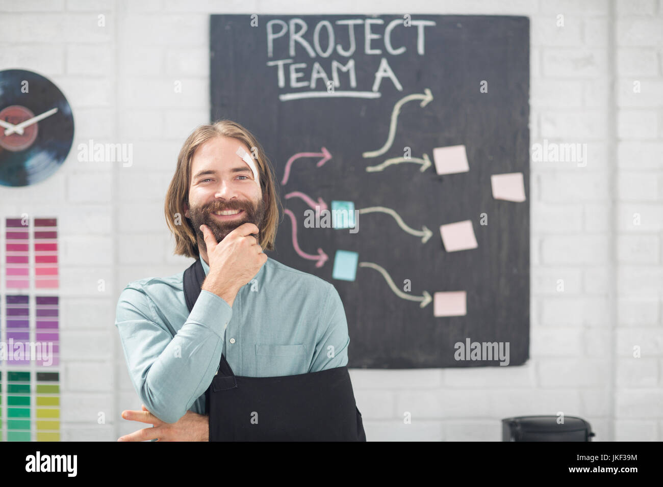 Office employee thinking of team project Stock Photo - Alamy