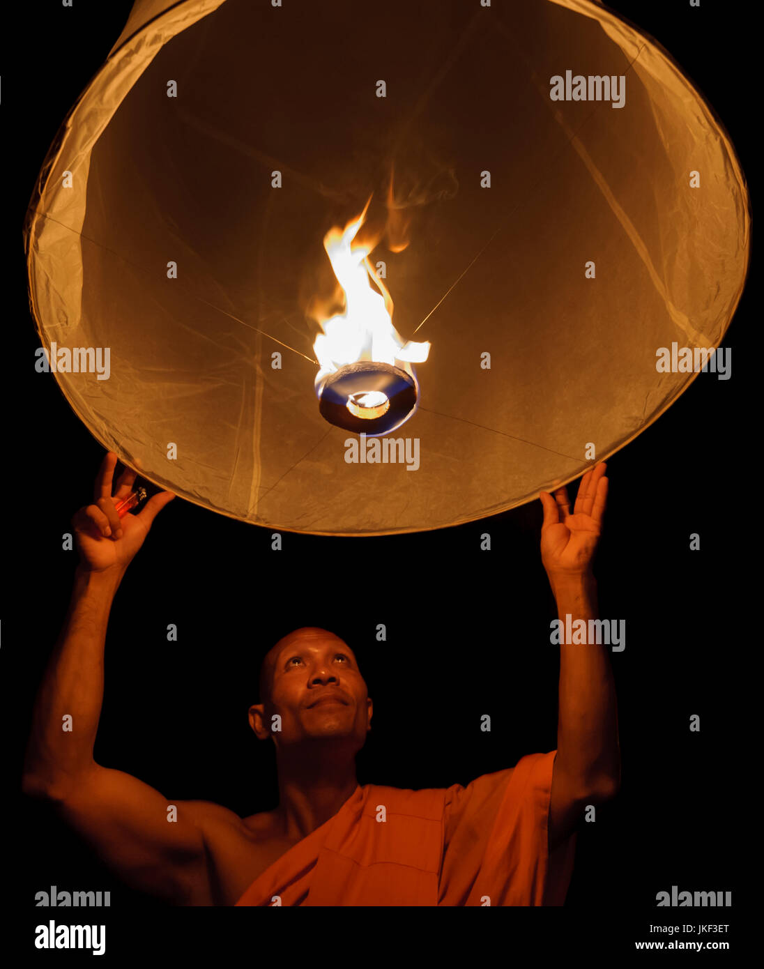 Thailand, Chiang Mai, Buddhist monk lighting lantern Stock Photo - Alamy