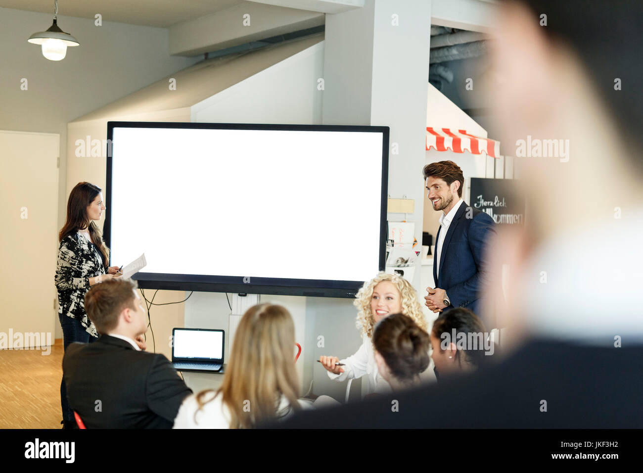 Presentation in office at large screen Stock Photo - Alamy