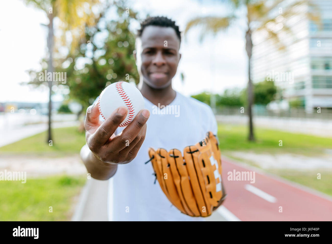 Hand holding baseball hi-res stock photography and images - Alamy