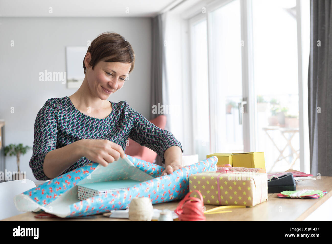 Woman packing gifts parcel box hi-res stock photography and images - Alamy
