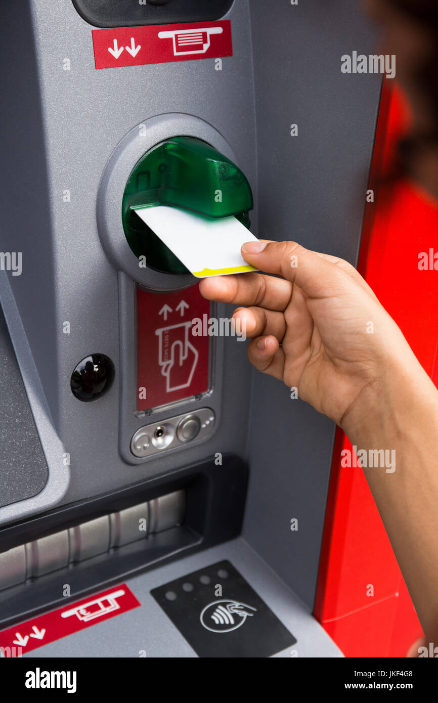 Hand of woman pushing credit card at cash dispenser, close-up Stock ...
