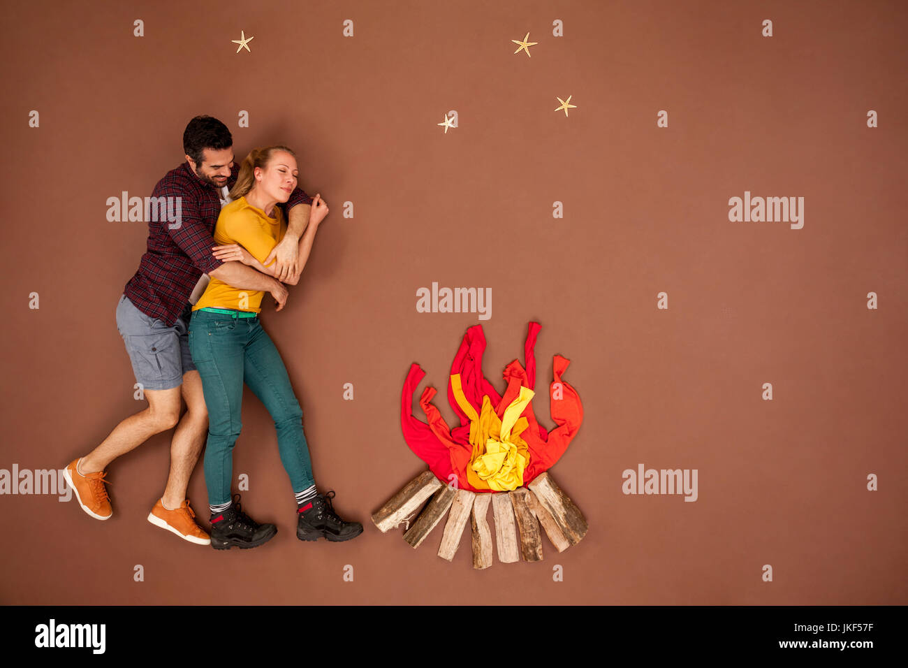 Couple hugging at the campfire Stock Photo - Alamy