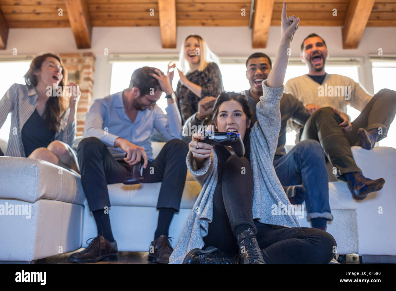 Friends playing computer game at home Stock Photo - Alamy