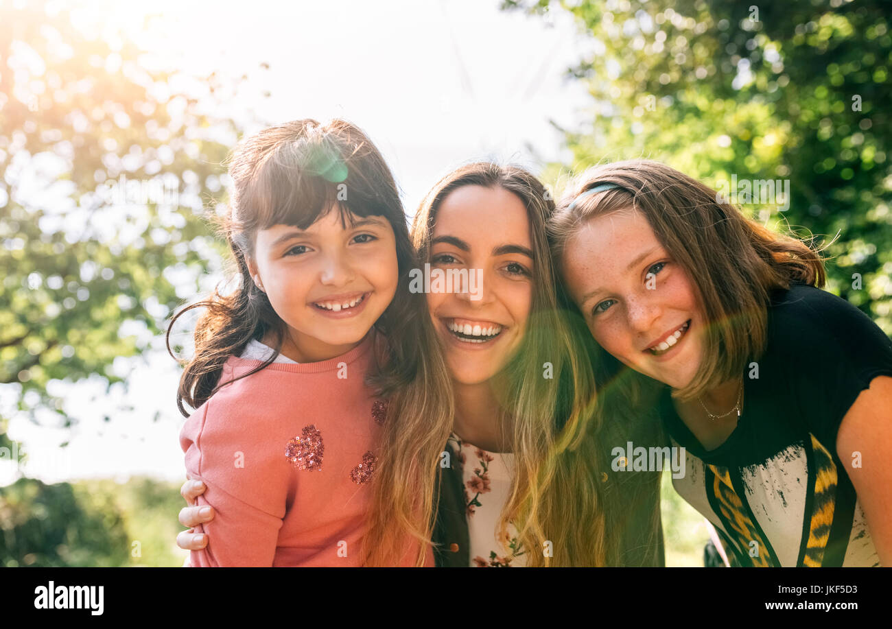 Portrait of three happy girls outdoors Stock Photo - Alamy