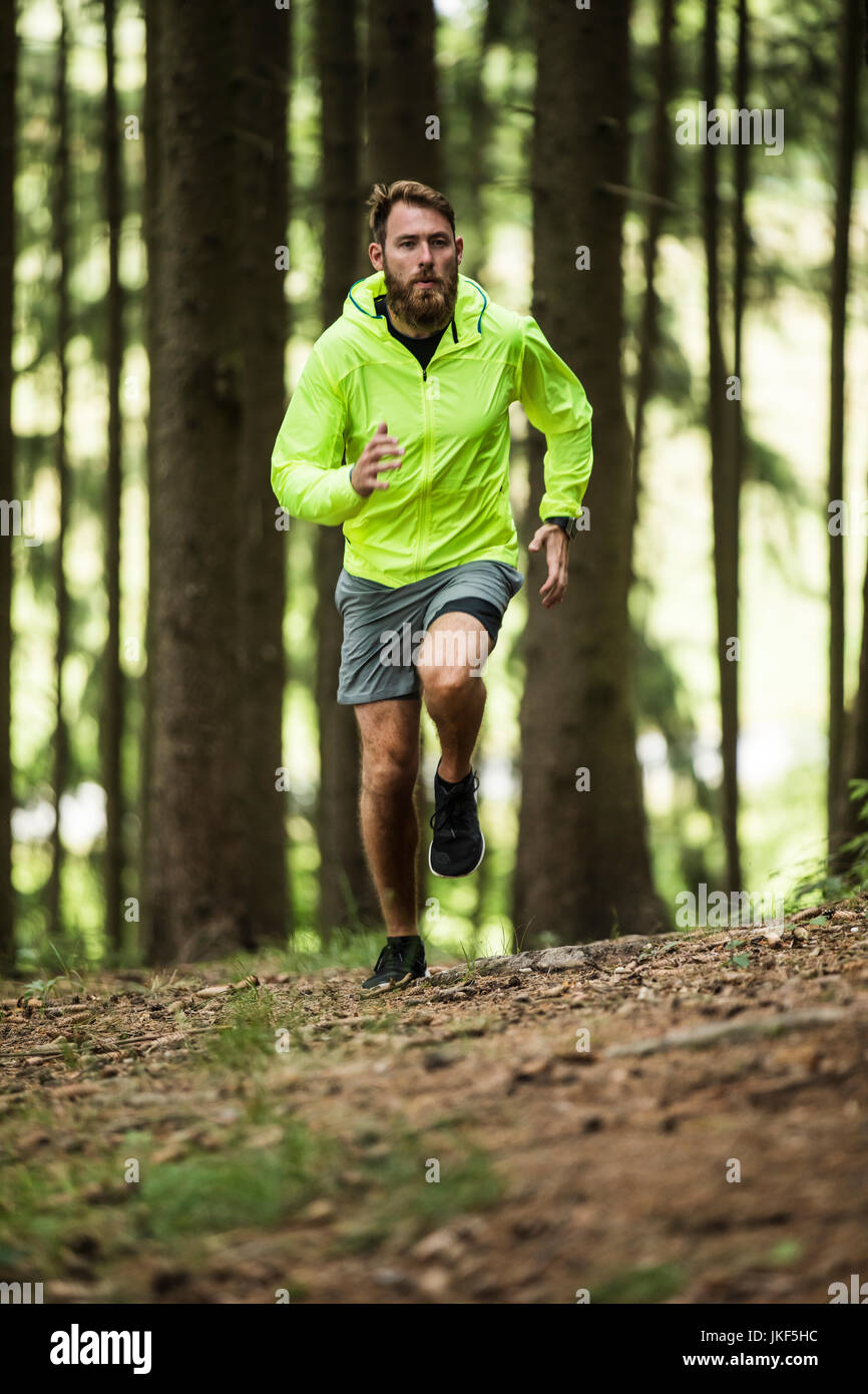 Man running in forest Stock Photo - Alamy