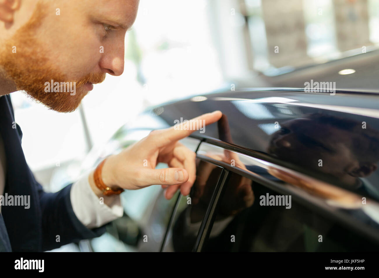Customer touching car paint with his finger Stock Photo - Alamy