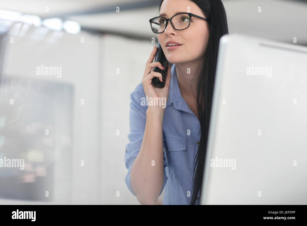 Employee on the phone Stock Photo - Alamy