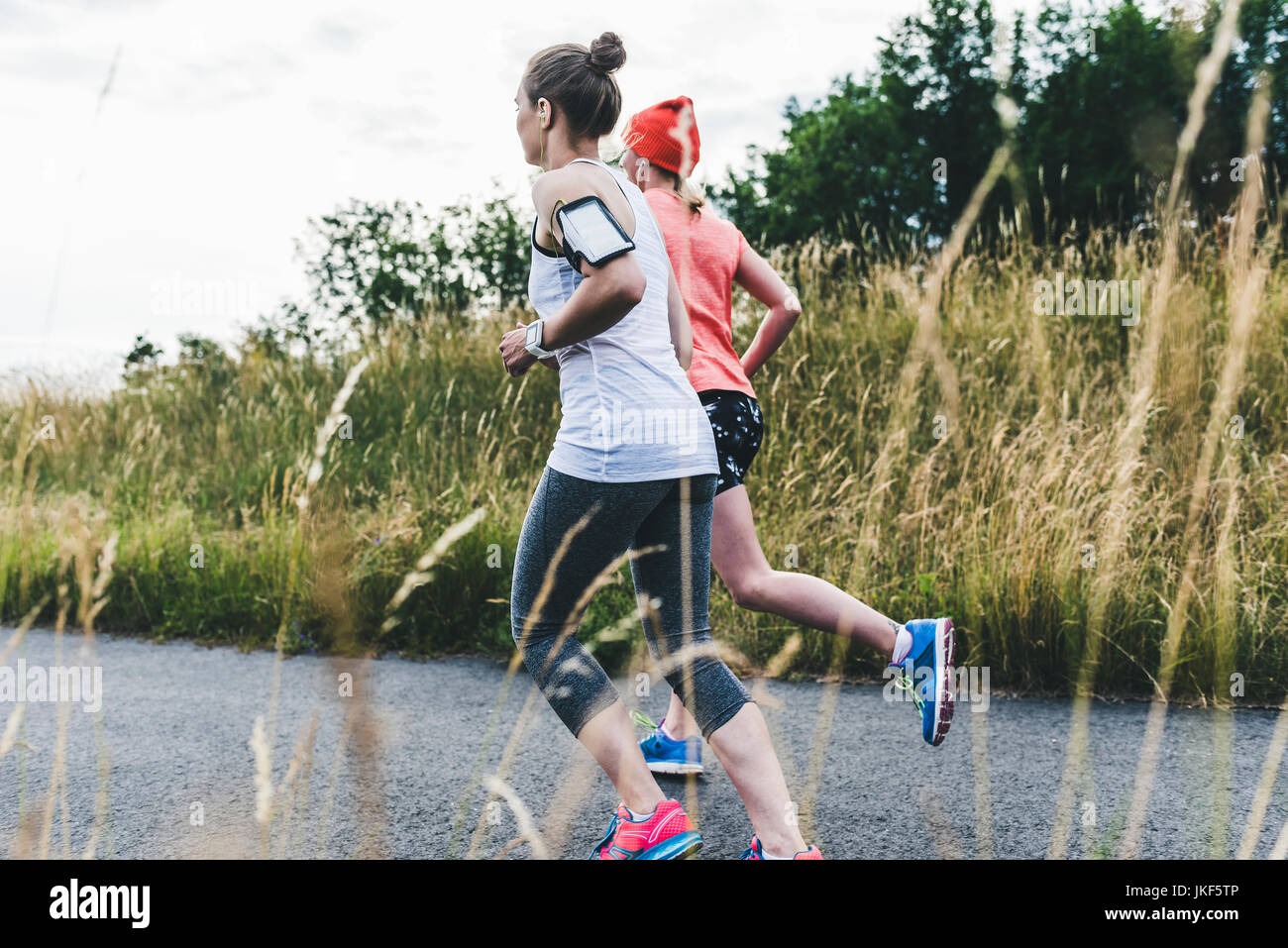 Two women jogging on country hi-res stock photography and images - Alamy