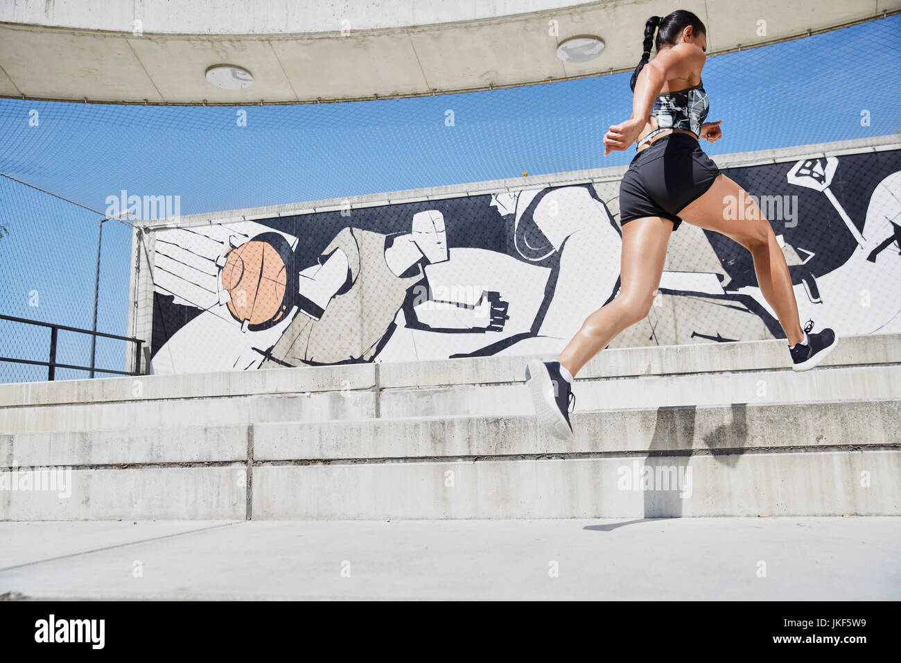 Fit woman running outdoors Stock Photo - Alamy