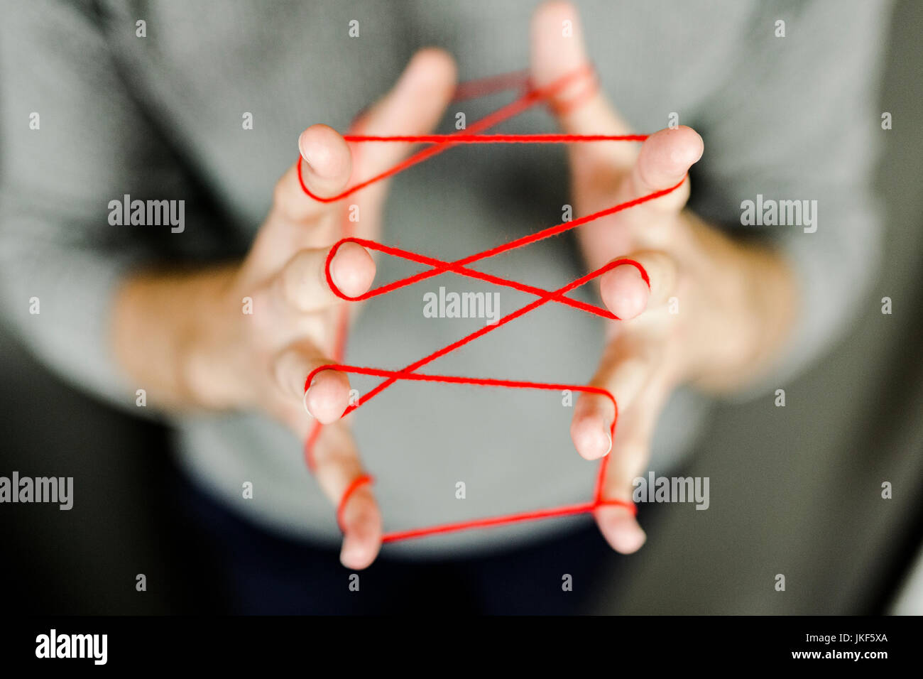 Close-up of man holding string Stock Photo - Alamy