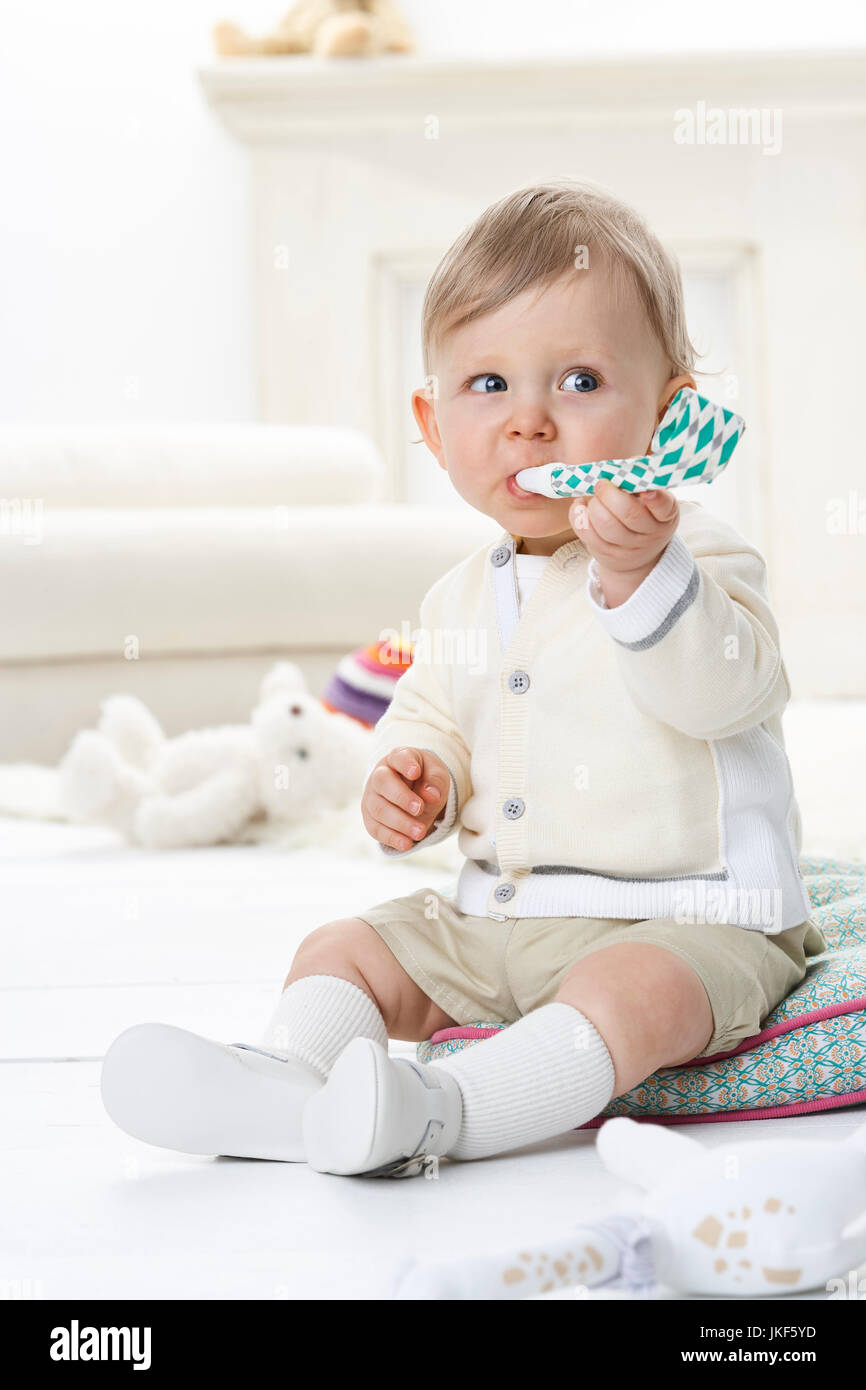 Portrait of toddler with party blow out Stock Photo - Alamy