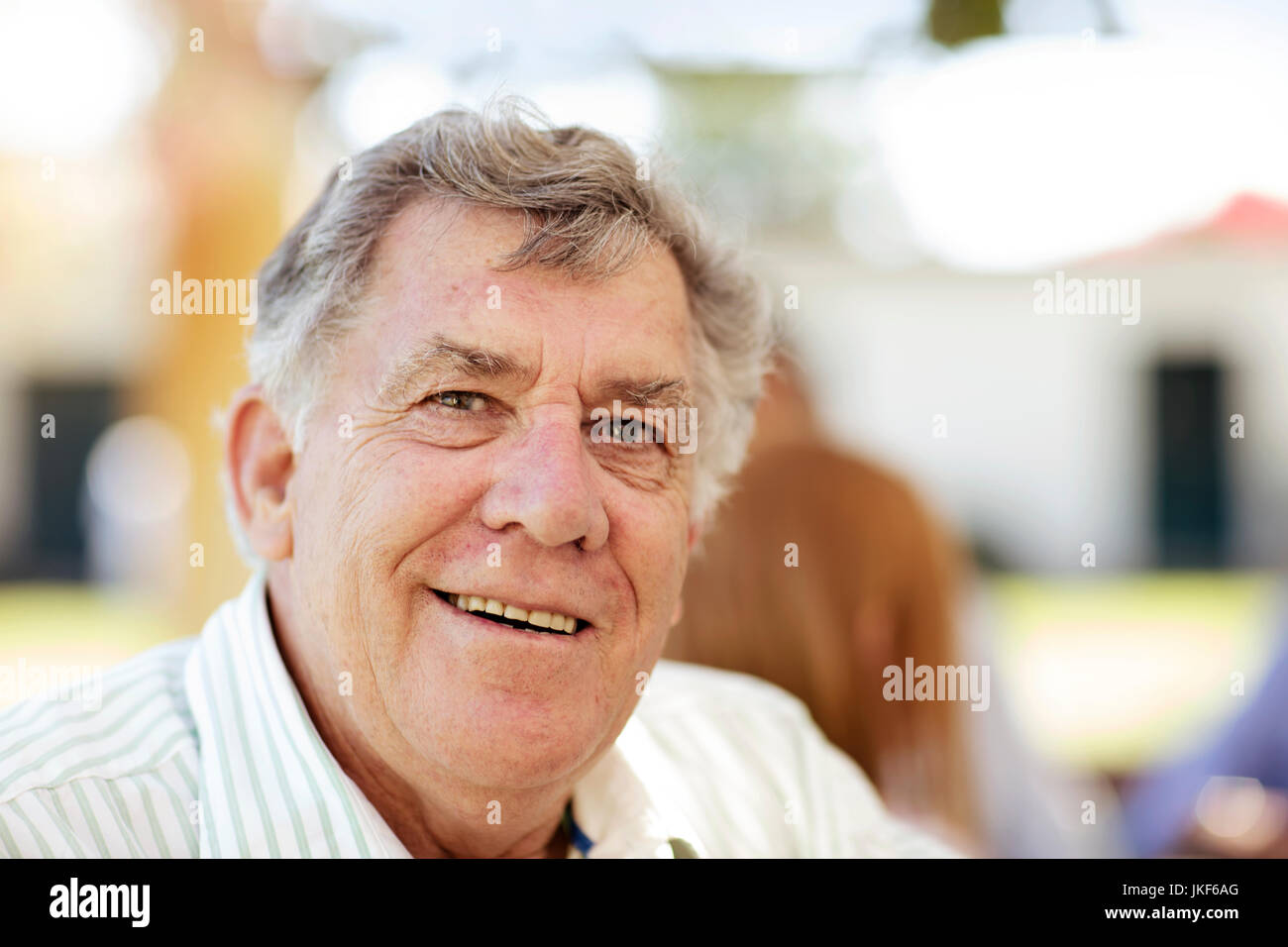 Portrait of smiling senior man outdoors Stock Photo - Alamy