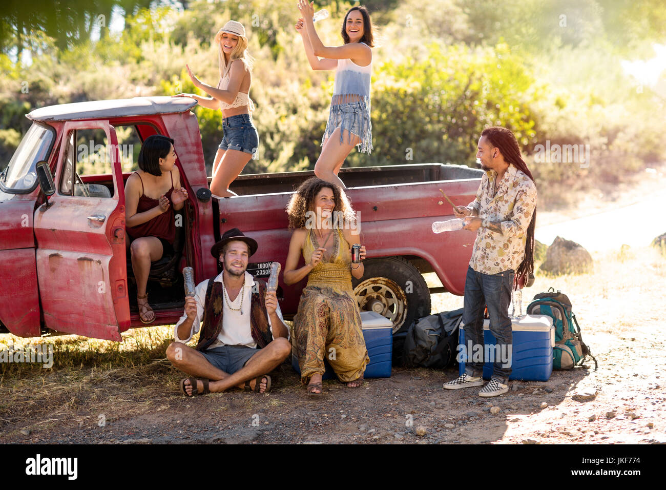 Happy young people outside pick up truck having a good time Stock Photo ...