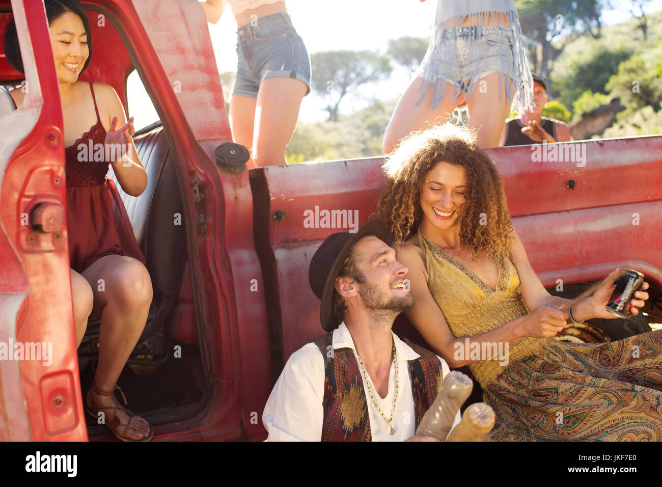 Happy young people outside pick up truck having a good time Stock Photo ...