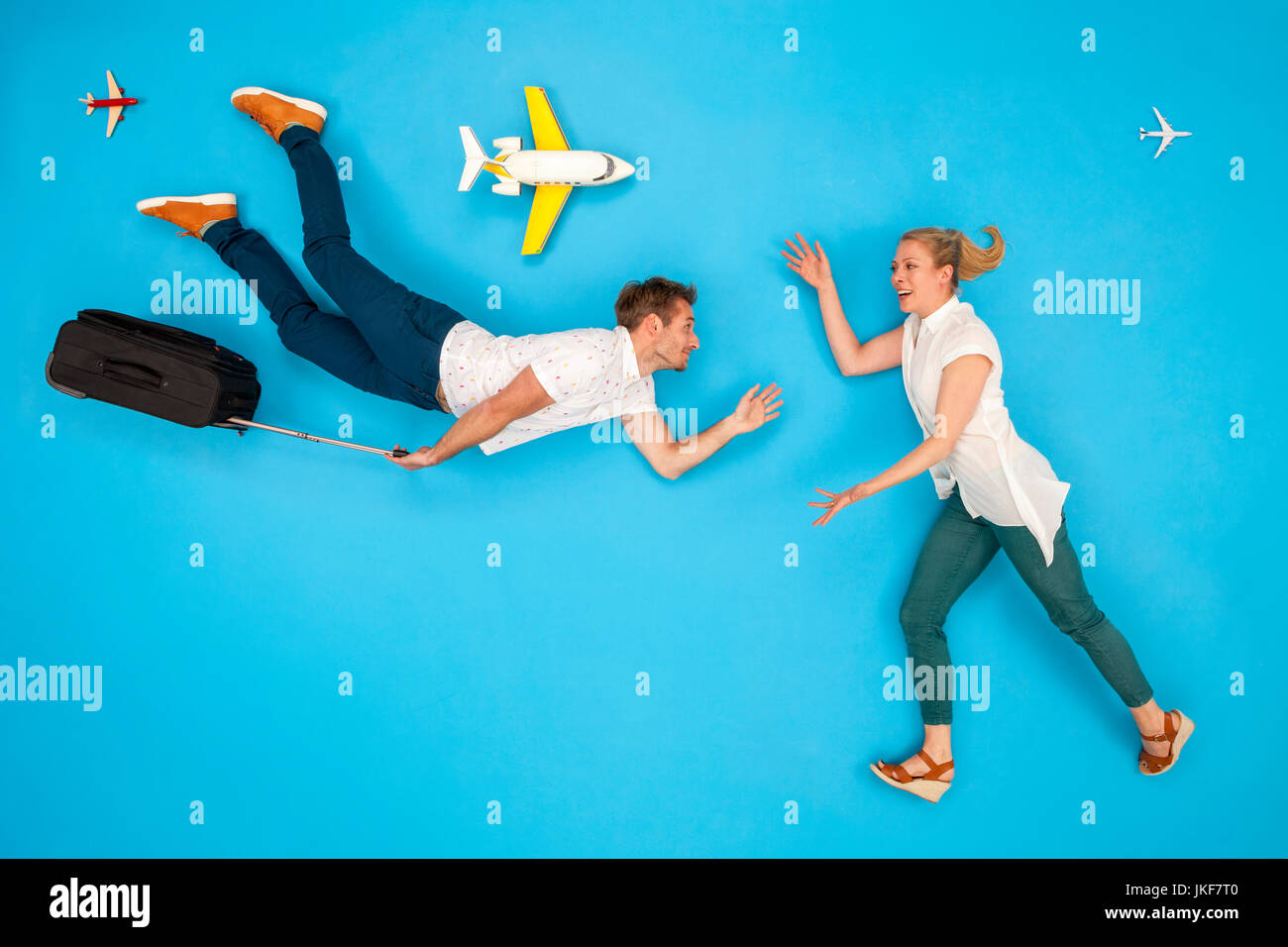 Happy couple reuniting after man coming back from journey Stock Photo ...