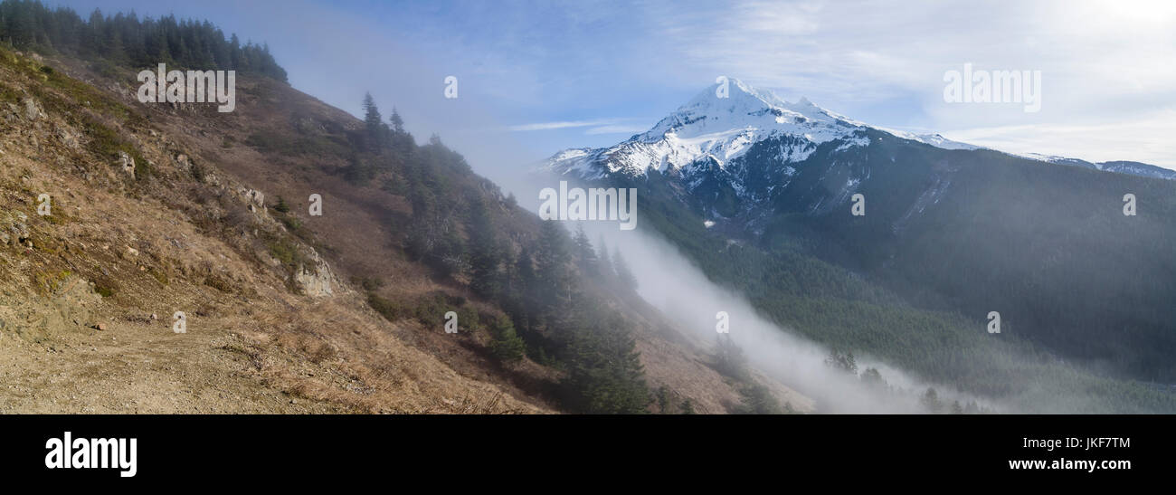 Fog rolling over the pass near snow capped Mt Hood Stock Photo - Alamy