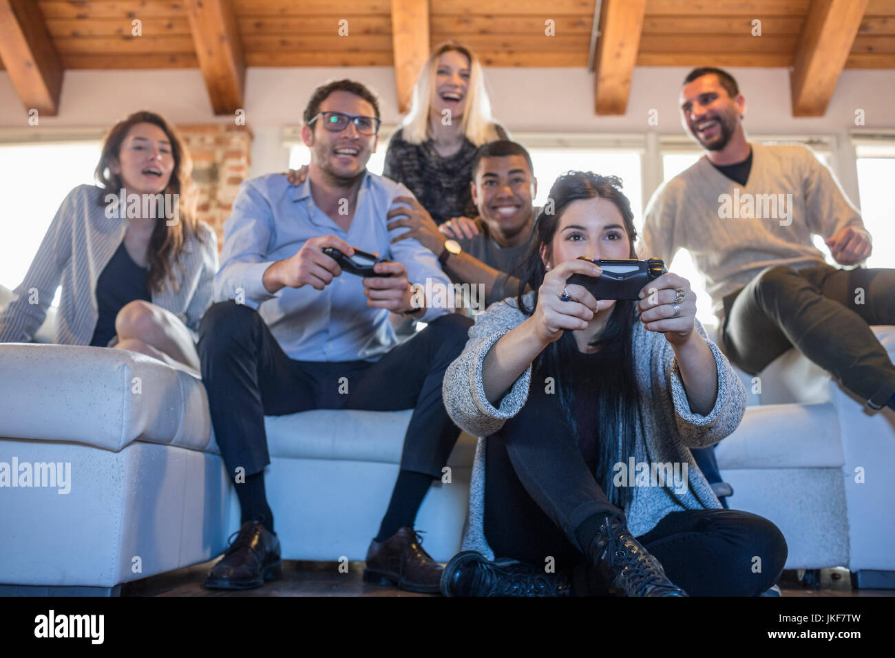 Friends playing computer game at home Stock Photo - Alamy