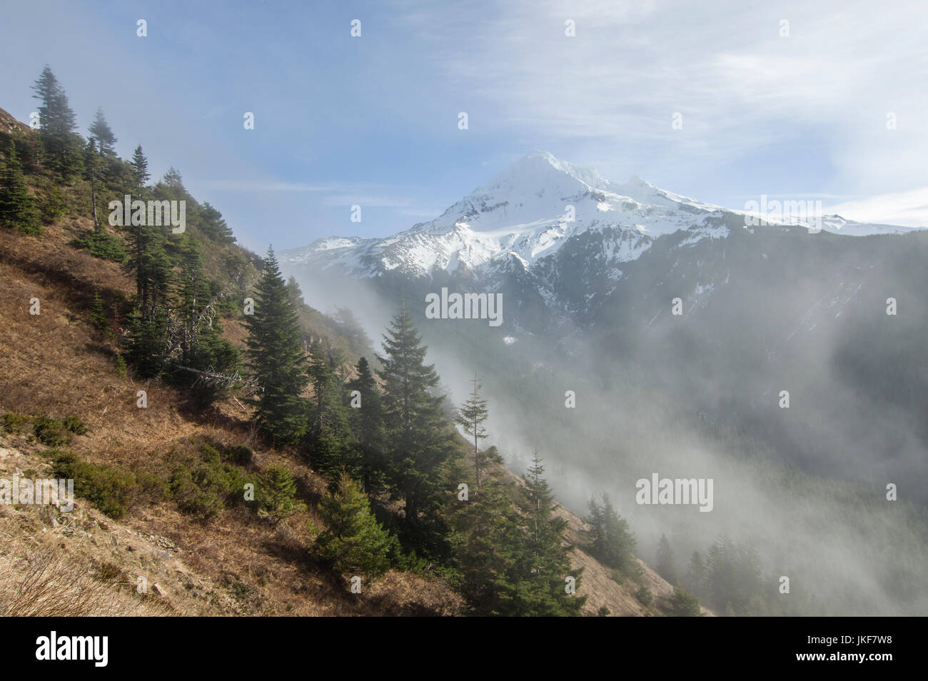 Fog rolling over the pass near snow capped Mt Hood Stock Photo - Alamy