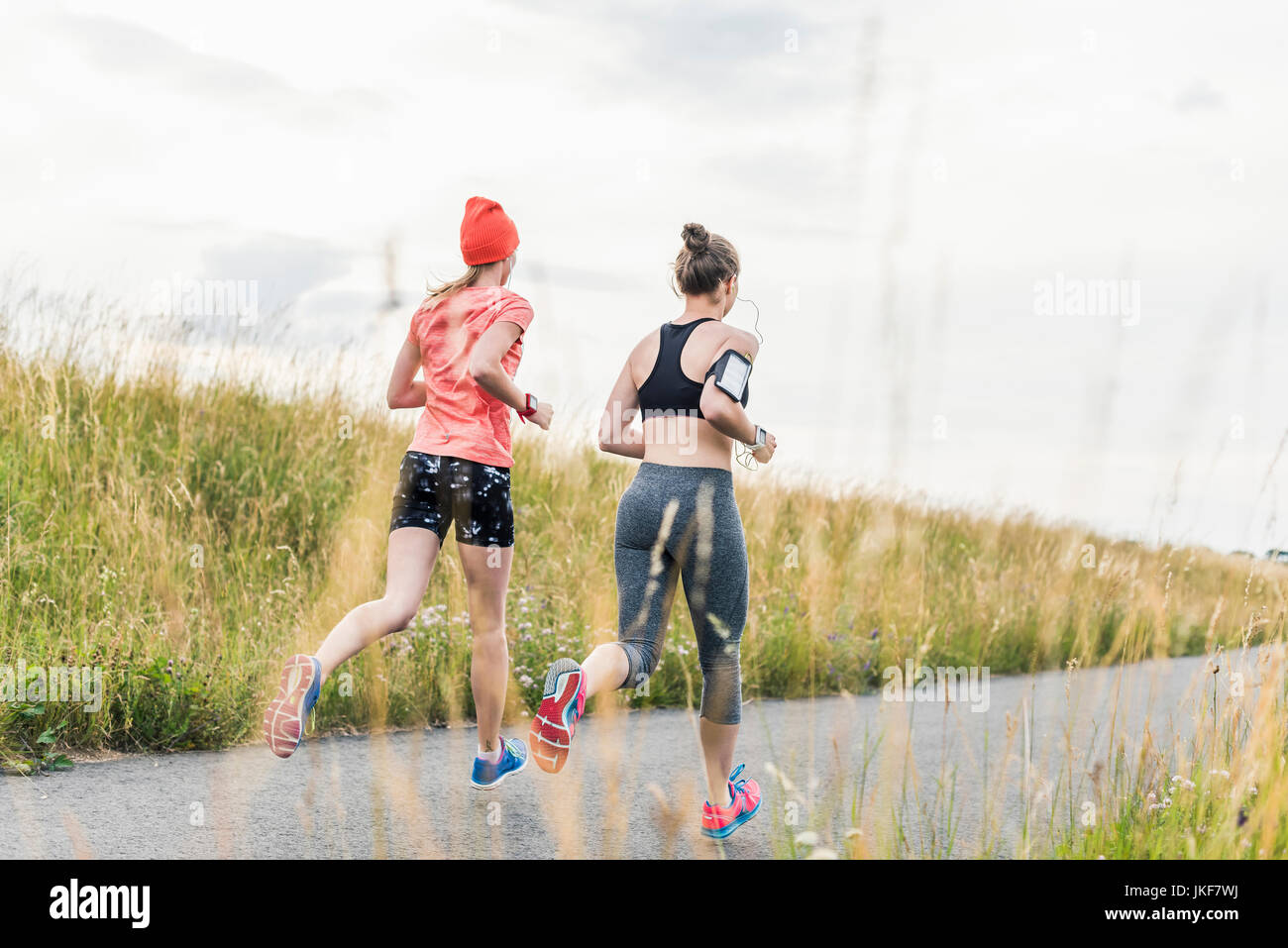 Two women jogging on country hi-res stock photography and images - Alamy