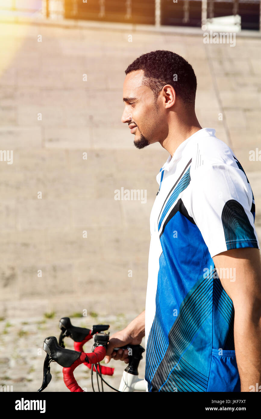 Athlete Pushing Bicycle High Resolution Stock Photography and Images ...