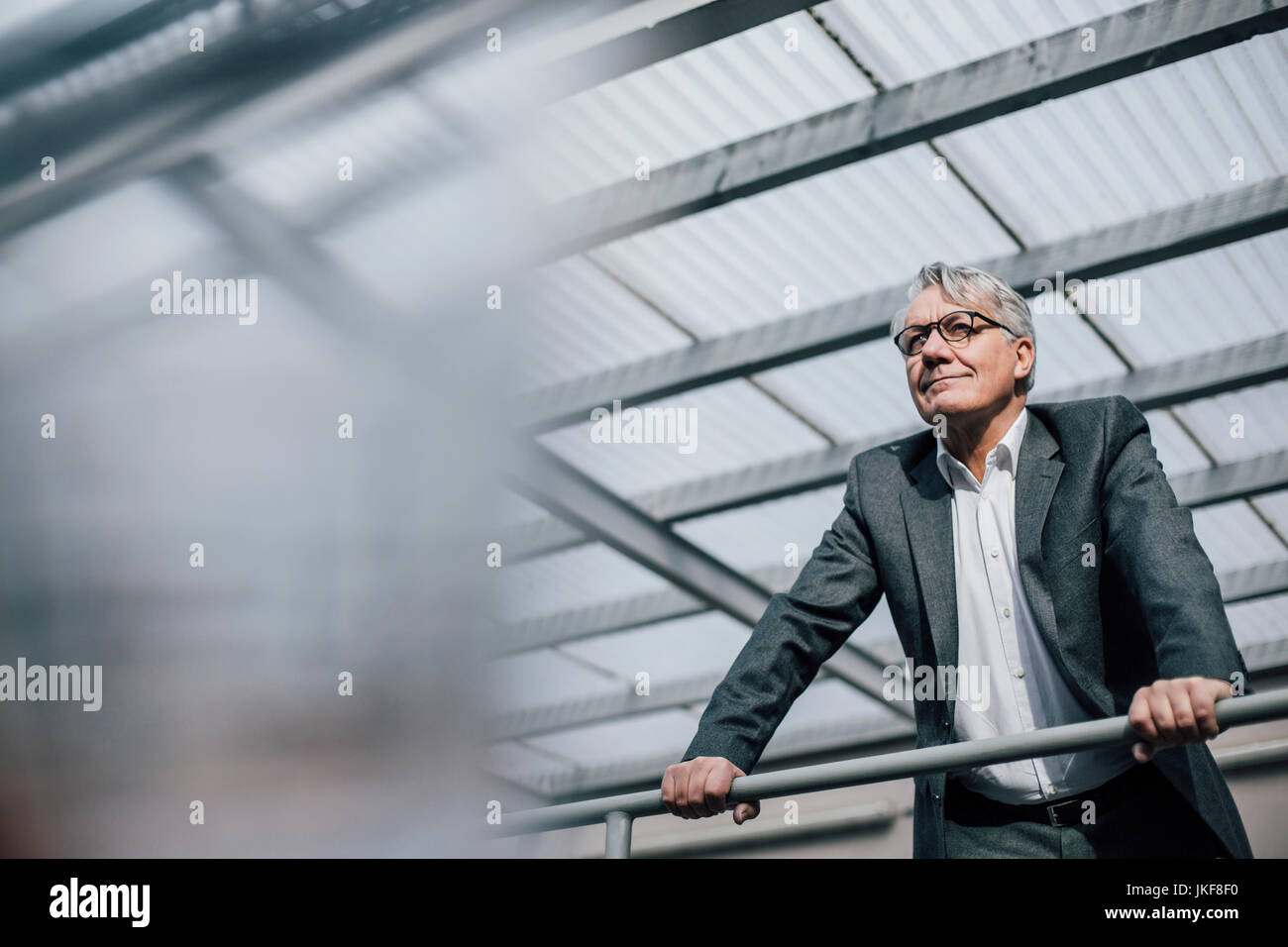 Standing holding looking away authority leadership hi-res stock ...