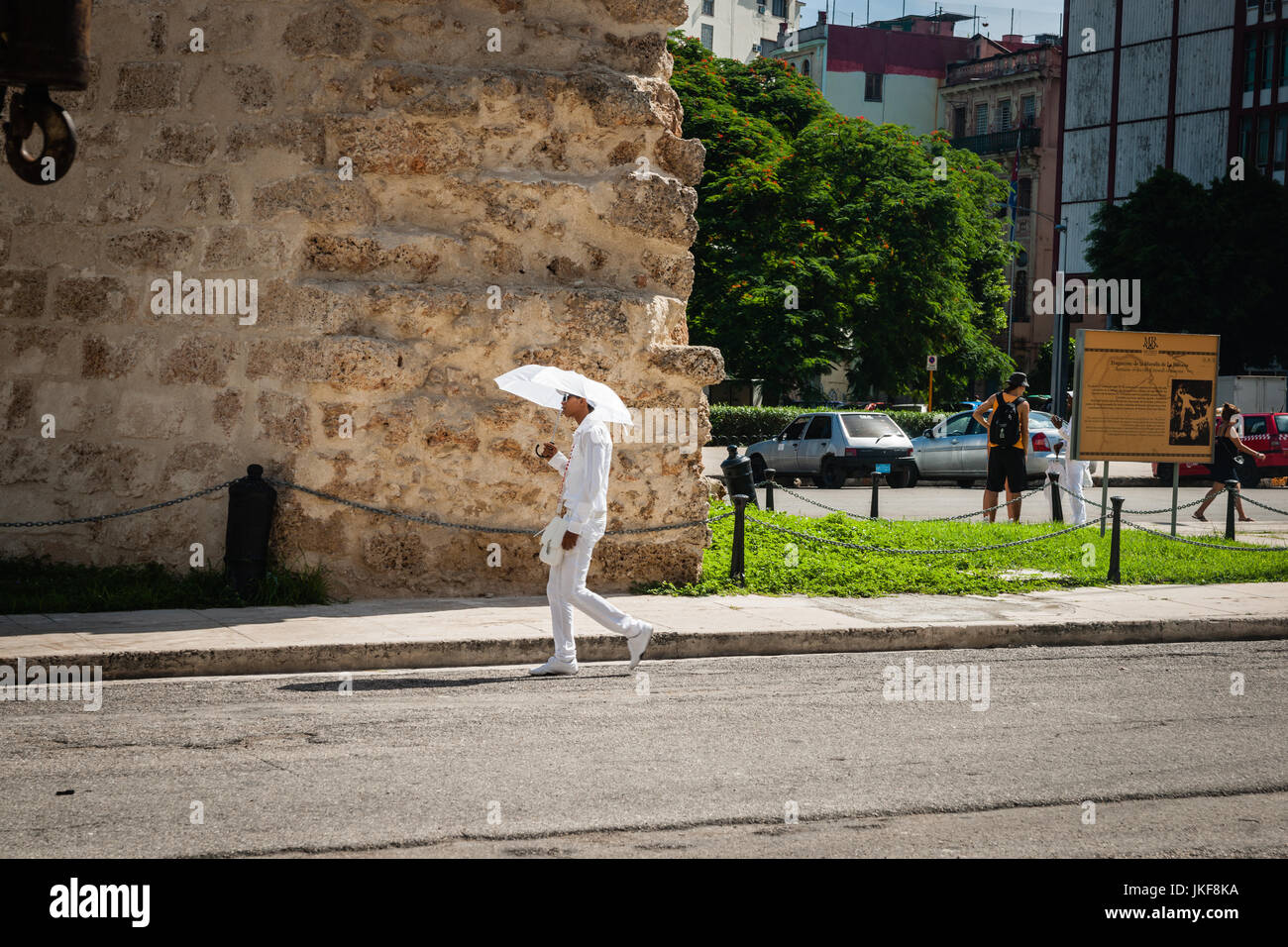 member of Santeria Cuban religious sect dressed in traditional all ...