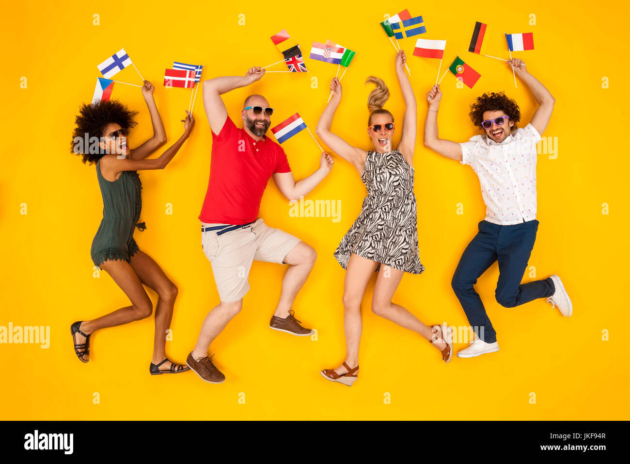 Group of people dancing and holding European flags Stock Photo - Alamy