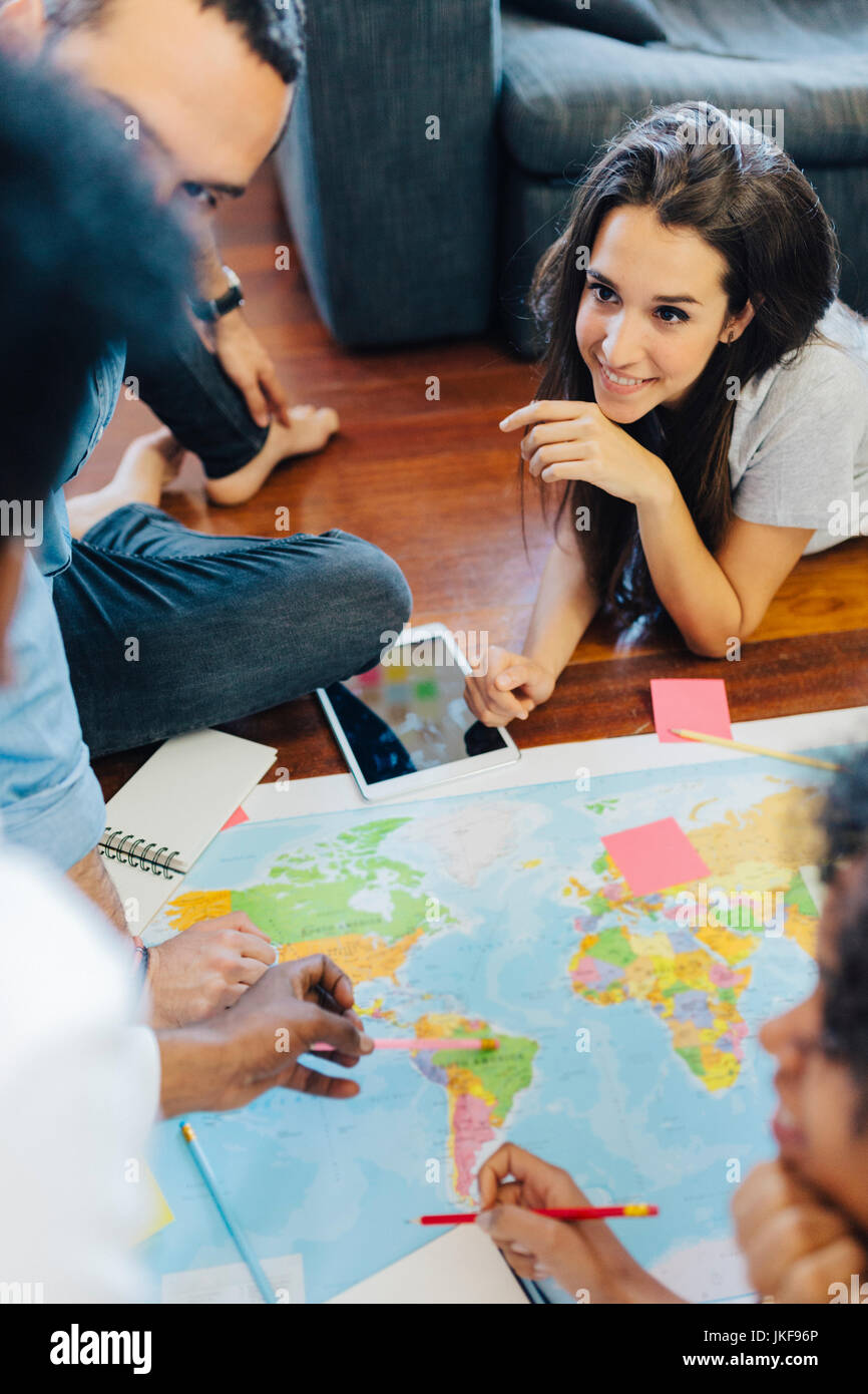 Group of friends planning vacation together Stock Photo - Alamy