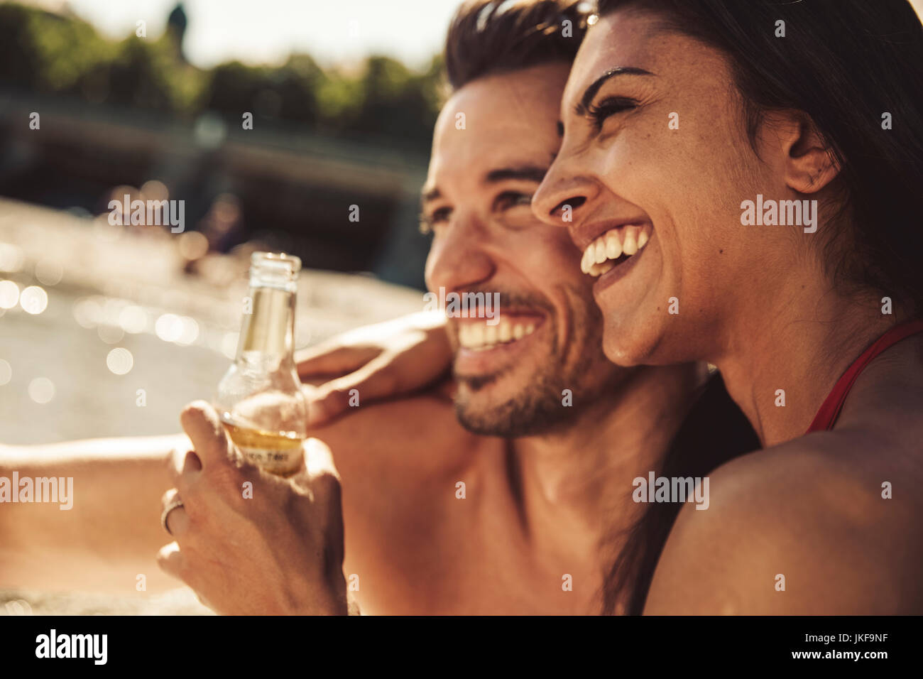Laughing couple on the beach Stock Photo - Alamy