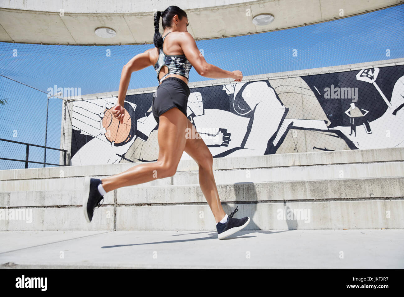 Fit woman running outdoors Stock Photo - Alamy