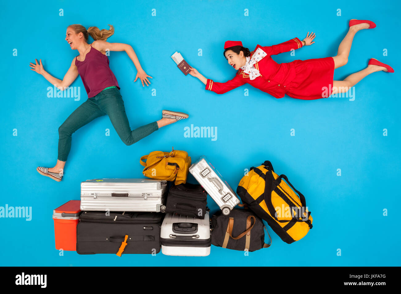 Flight attendant chasing passenger, jumping over luggage Stock Photo ...