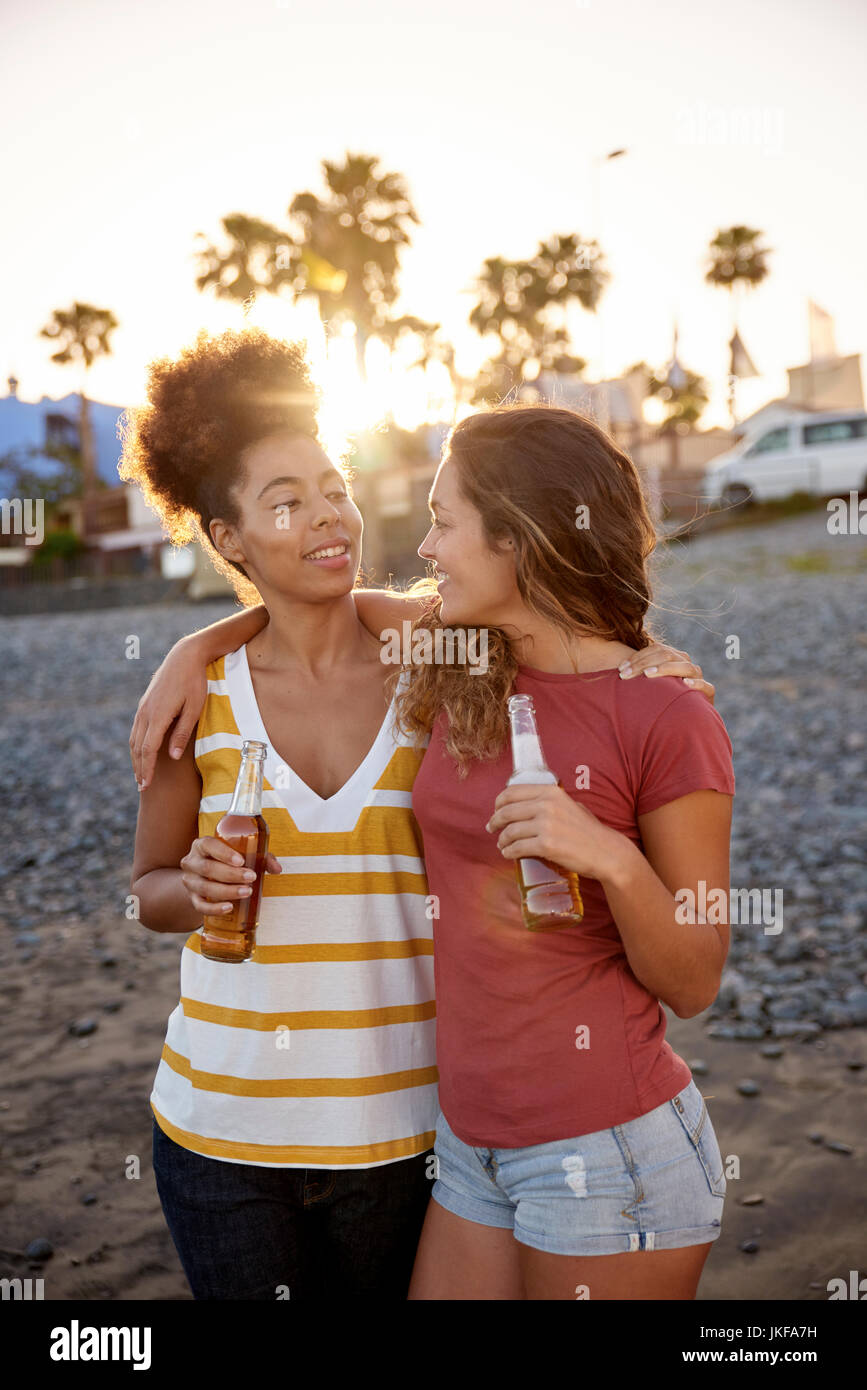 Two best friends having fun on the beach Stock Photo - Alamy