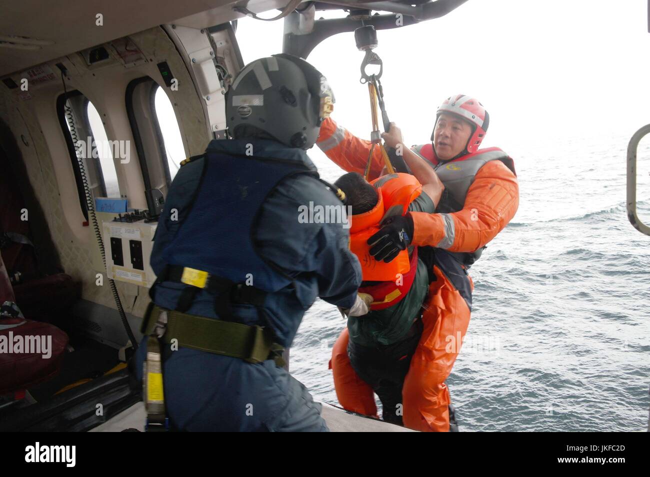 Crew members helicopter sea hi-res stock photography and images - Alamy